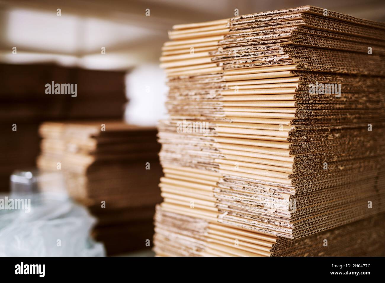 Pile of unmade boxes. Storage interior Stock Photo - Alamy