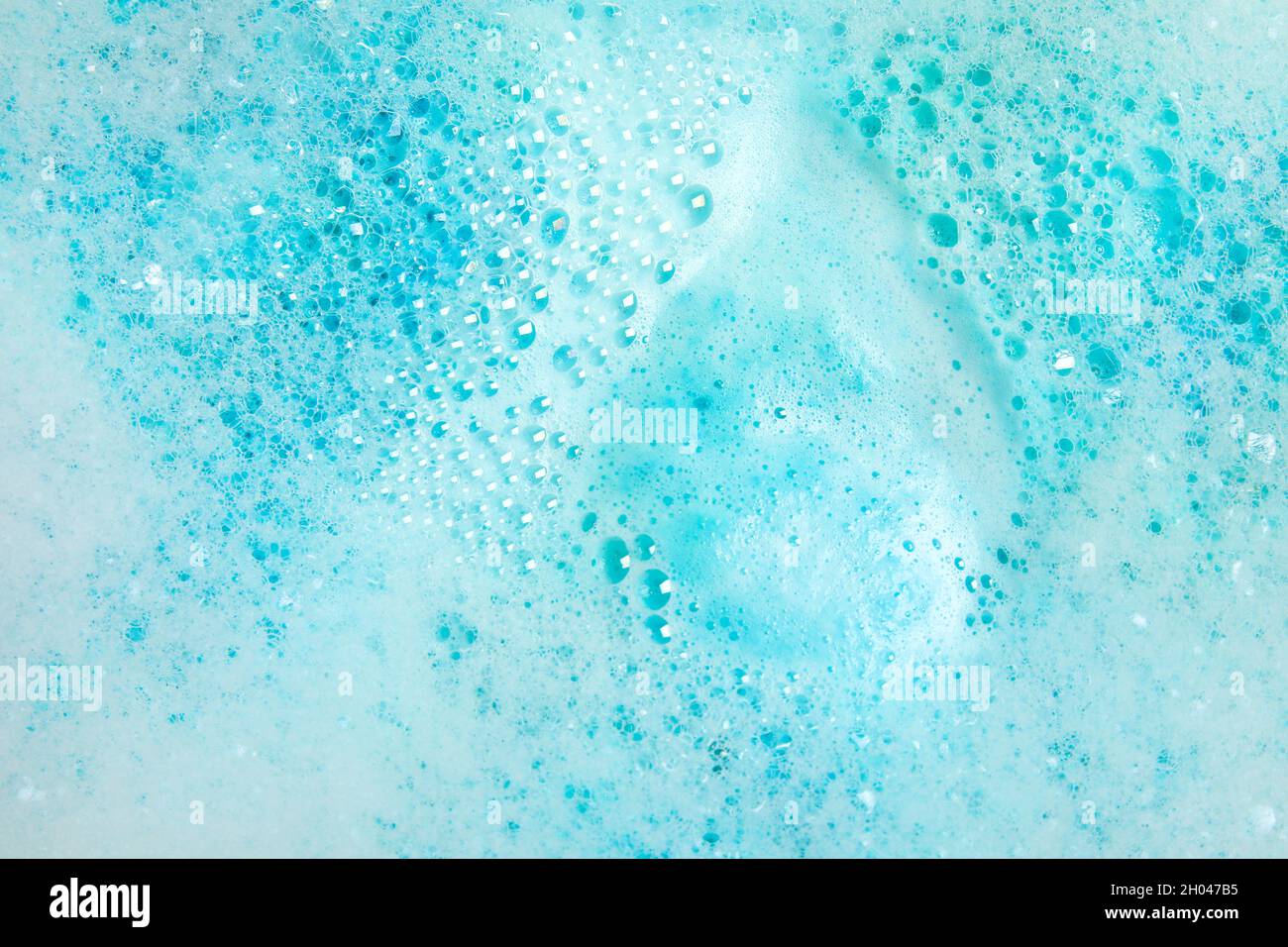 View of foam after dissolving color bath bomb in water, closeup Stock ...