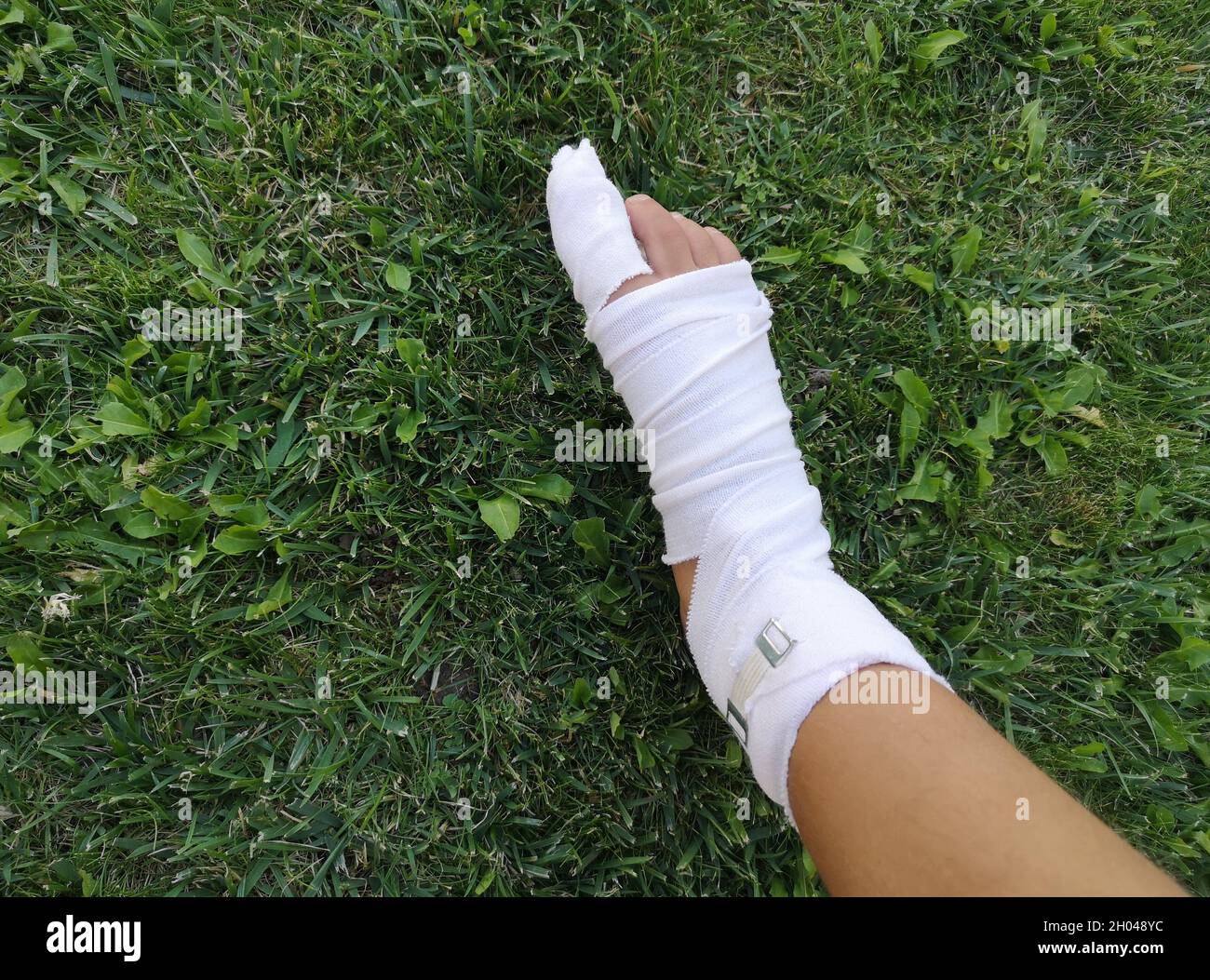 Boy with foot bandage Stock Photo - Alamy