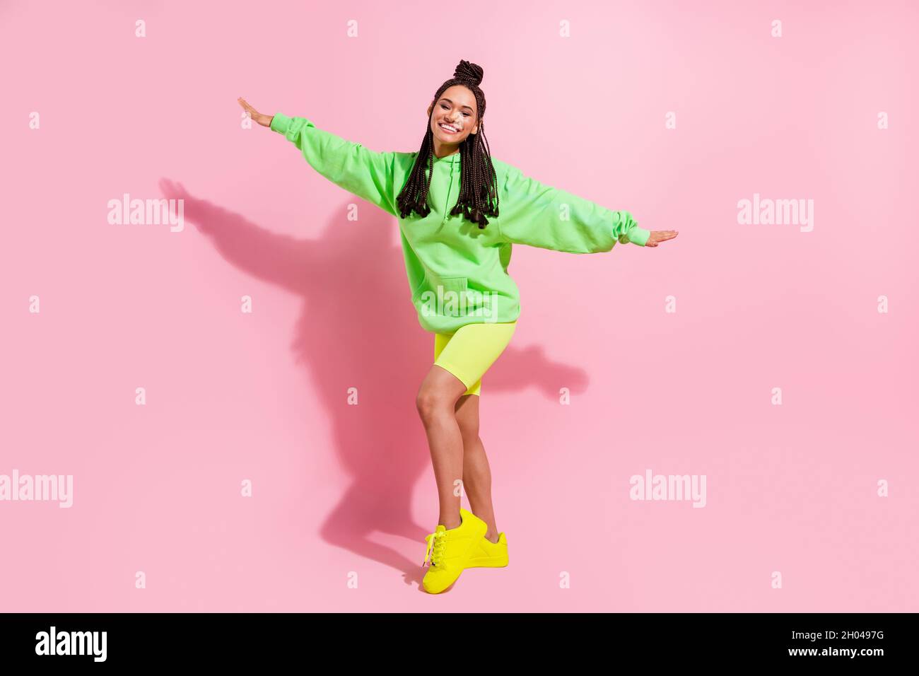 Full length photo of happy dark skin young woman hands plane fly smile ...