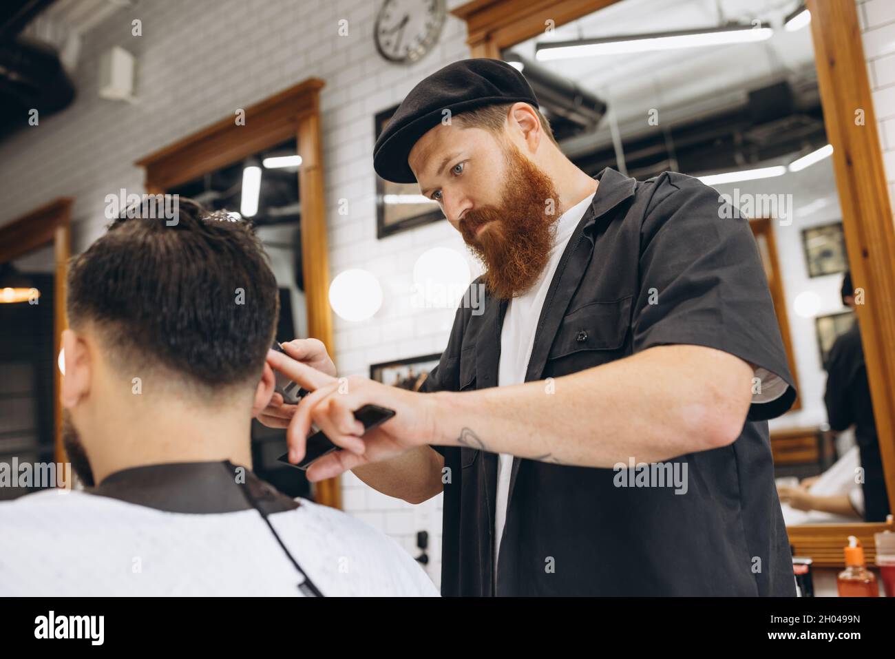 Professional barber at work process. Beauty, selfcare, style, fashion ...