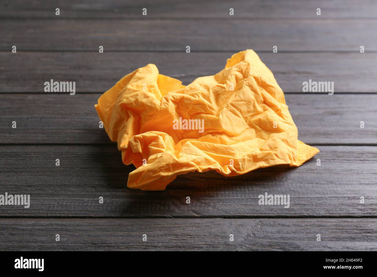 Crumpled paper napkin on wooden background. Personal hygiene Stock ...