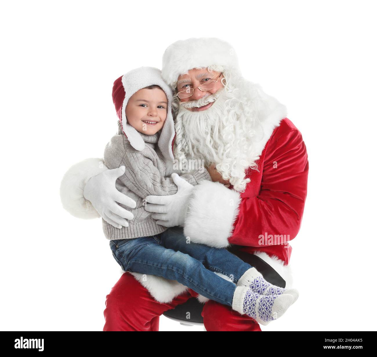 Little boy hugging authentic Santa Claus on white background Stock ...