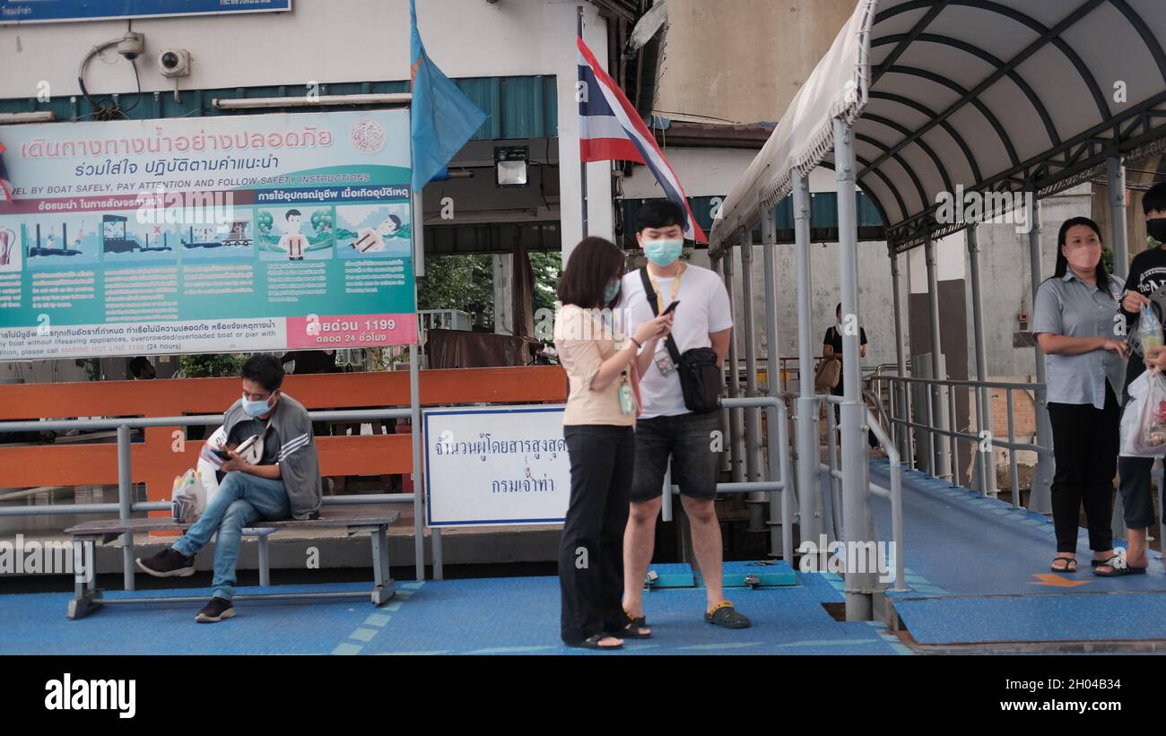 People Boarding at Sathorn Pier Gangplank Along the Chao Phraya River ...