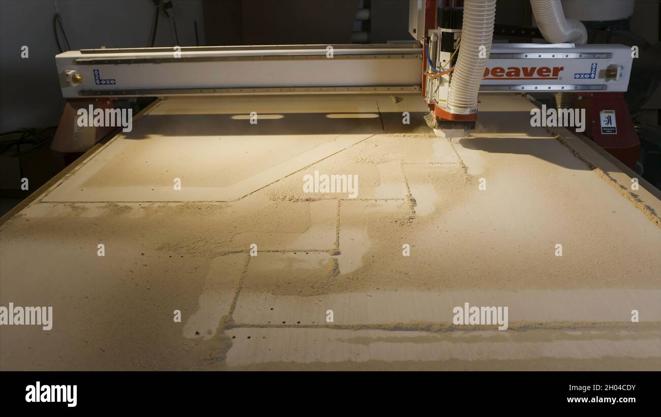 Wood cutting machine. Action. Automated machine cutting wooden boards ...