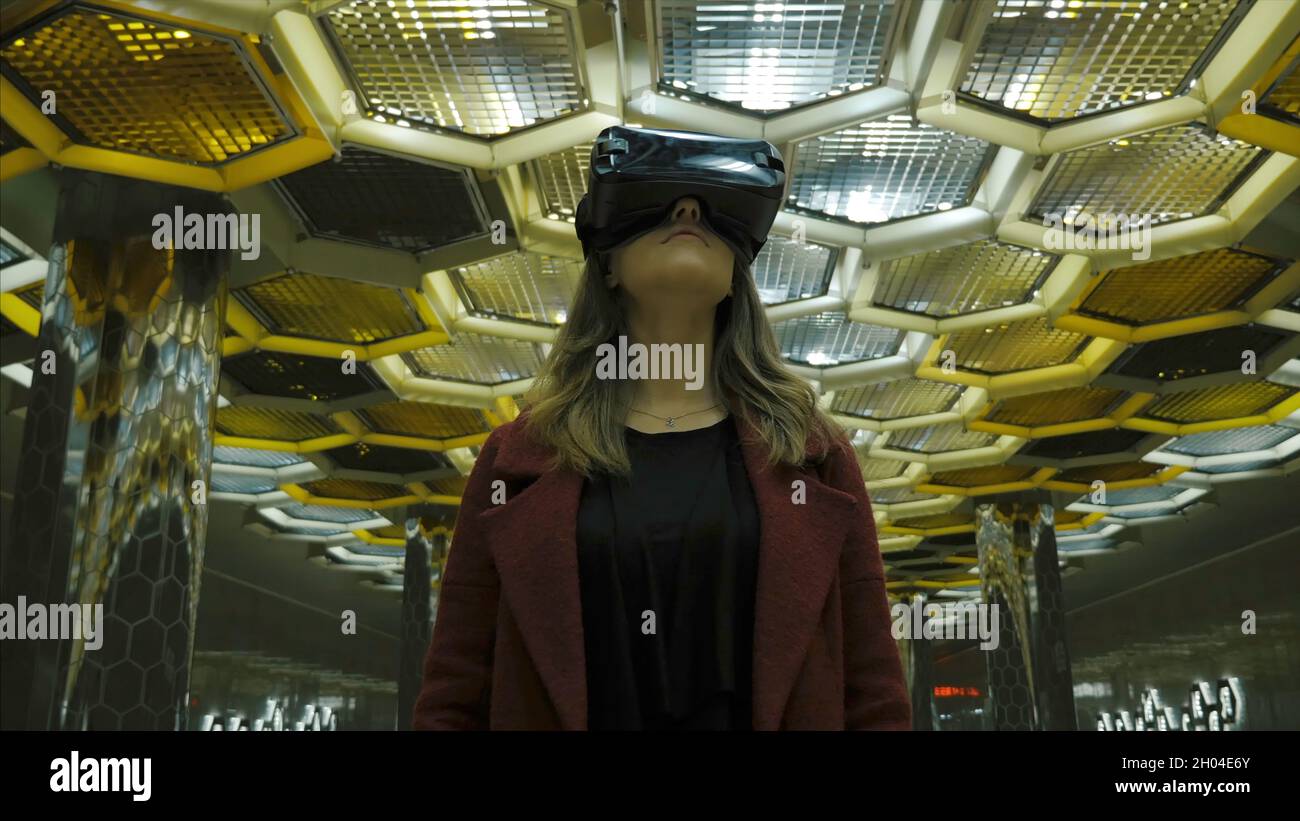 Girl experiencing virtual reality eyeglasses. Young woman wearing ...