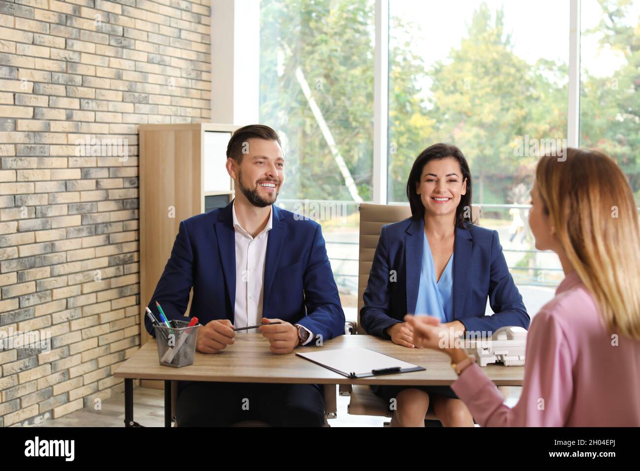 Human resources commission conducting job interview with applicant in office Stock Photo - Alamy