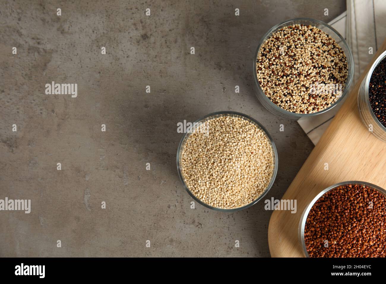 Flat lay composition with different types of quinoa and space for text ...