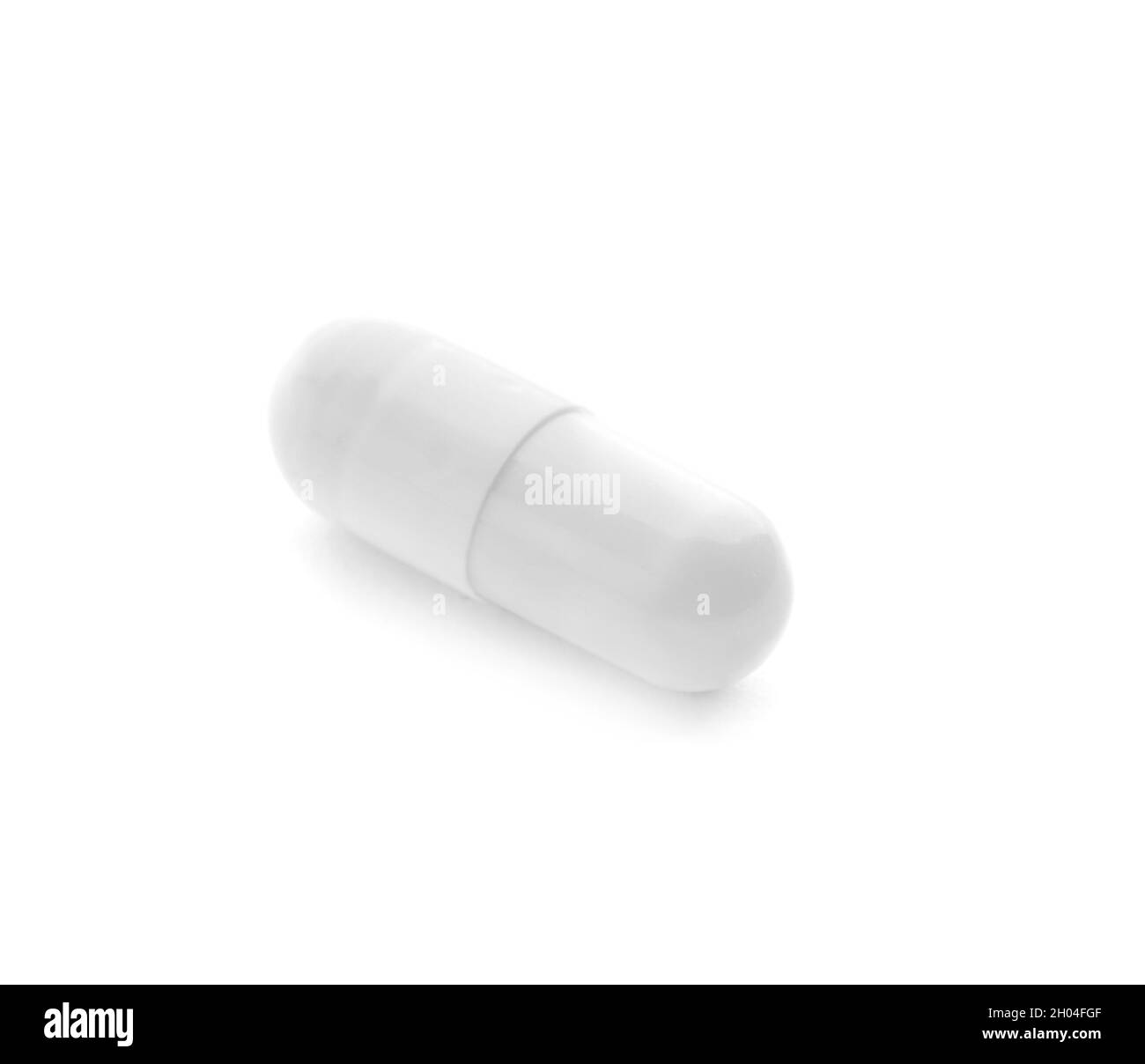 Capsule on white background Stock Photo - Alamy