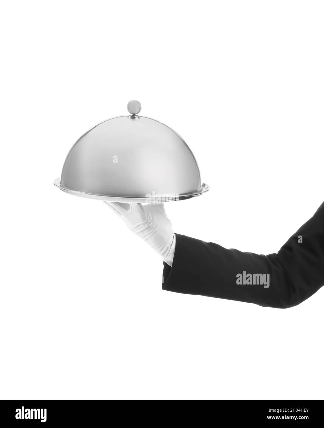 Waiter holding metal tray with lid on white background Stock Photo - Alamy
