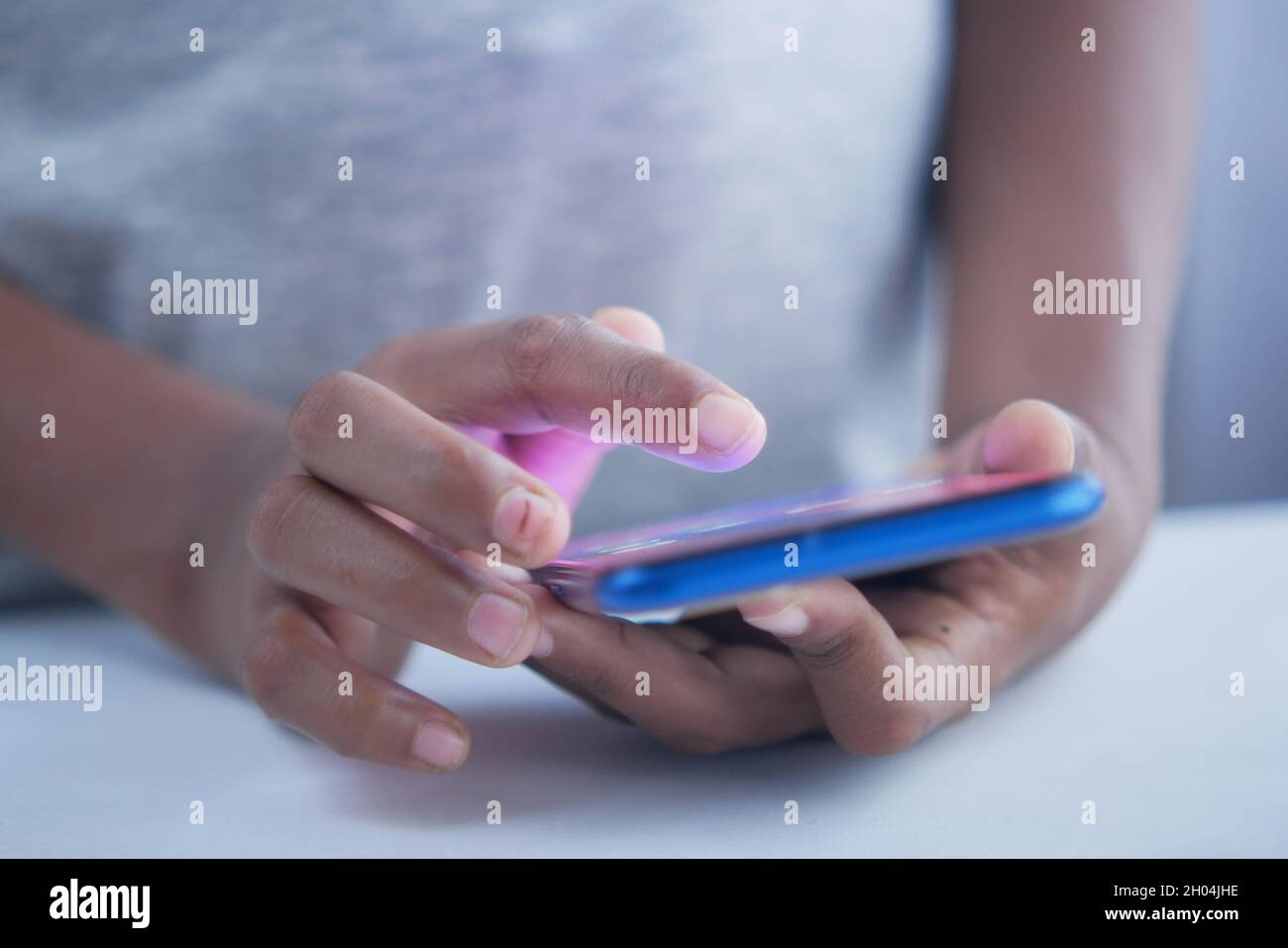 child hand pointing finger on smart phone screen Stock Photo - Alamy