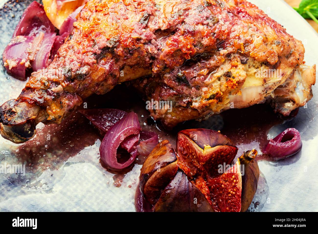 Chicken meat fried in fig fruit. Meat grilled with figs sauce Stock ...