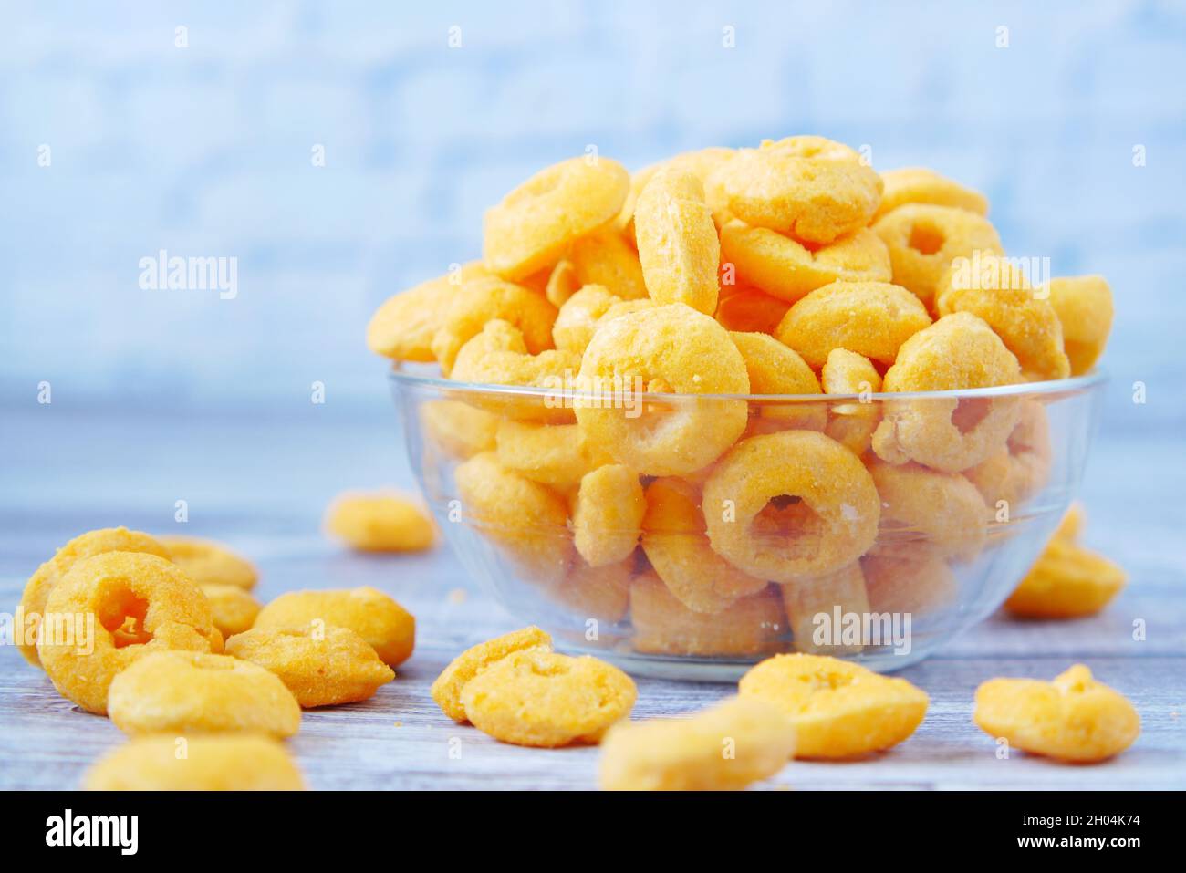 puffed corn rings chips in black bowl on white background Stock Photo ...