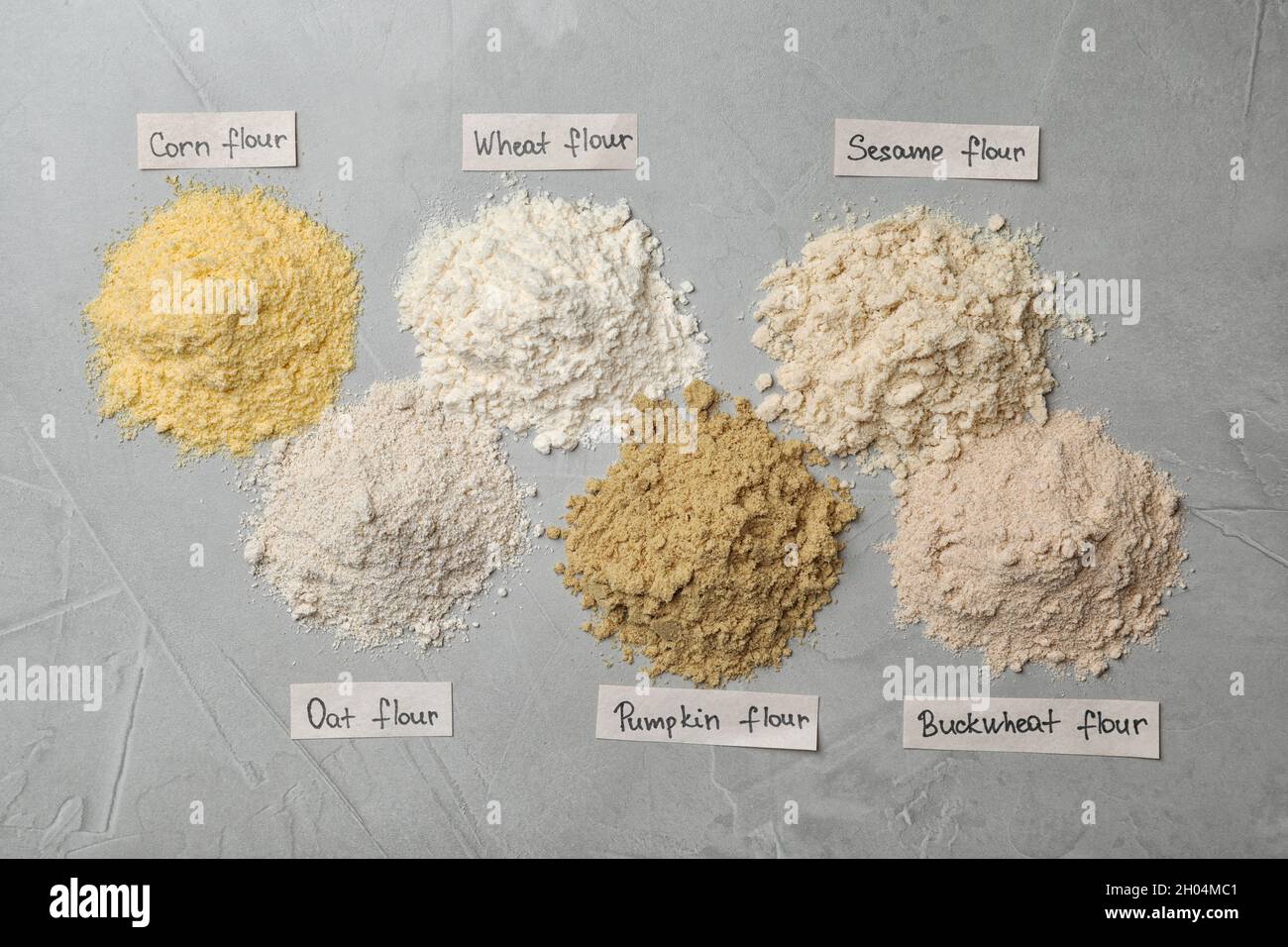 Composition with different types of flour on light background Stock ...