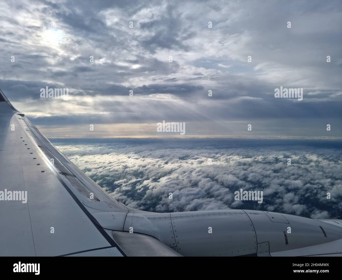 Airplane in dramatic cloudscape hi-res stock photography and images - Alamy