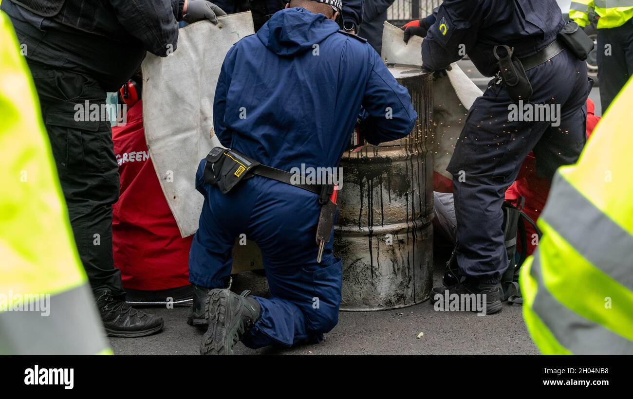 London, UK. 11th Oct, 2021. Greenpeace activists block Whitehall ...