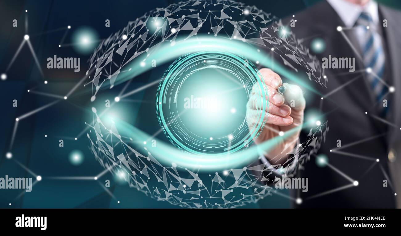 Man touching a digital eye concept on a touch screen with a stylus pen ...