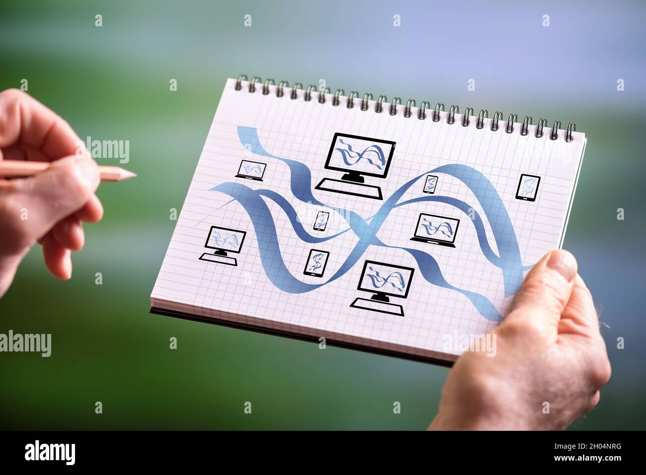 Hand drawing network communication concept on a notepad Stock Photo - Alamy