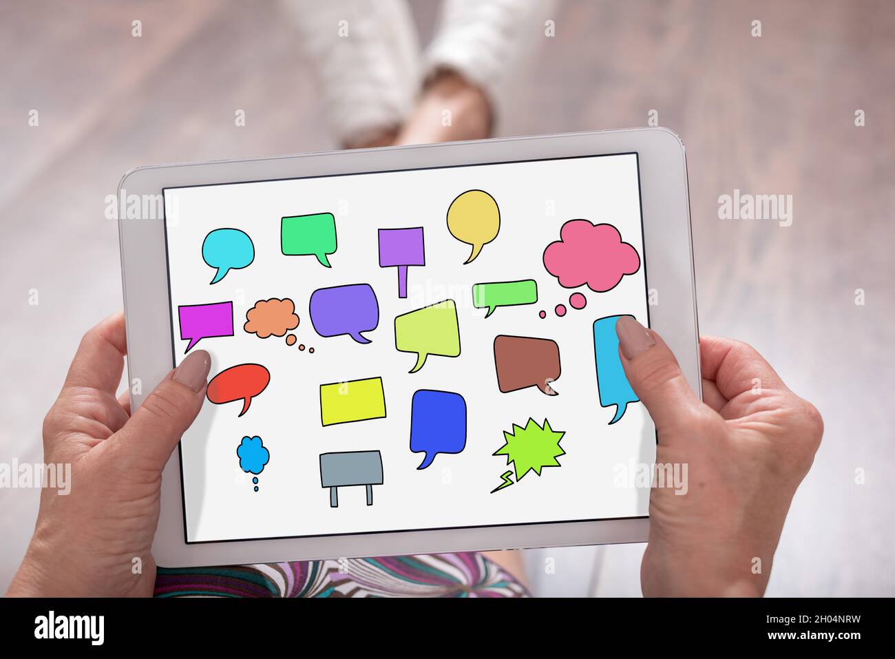 Communication concept shown on a tablet held by a woman Stock Photo - Alamy