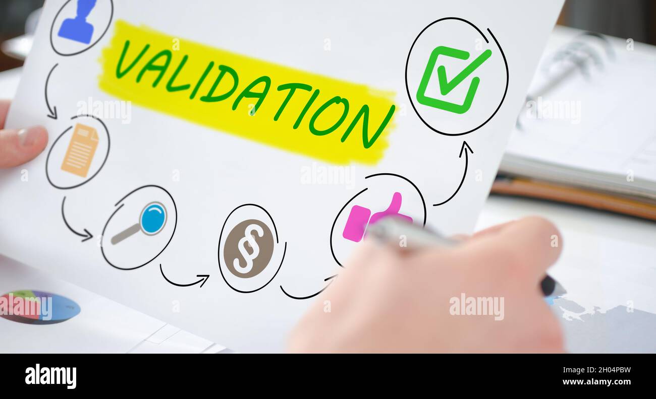 Hands holding a paper showing a validation concept Stock Photo - Alamy