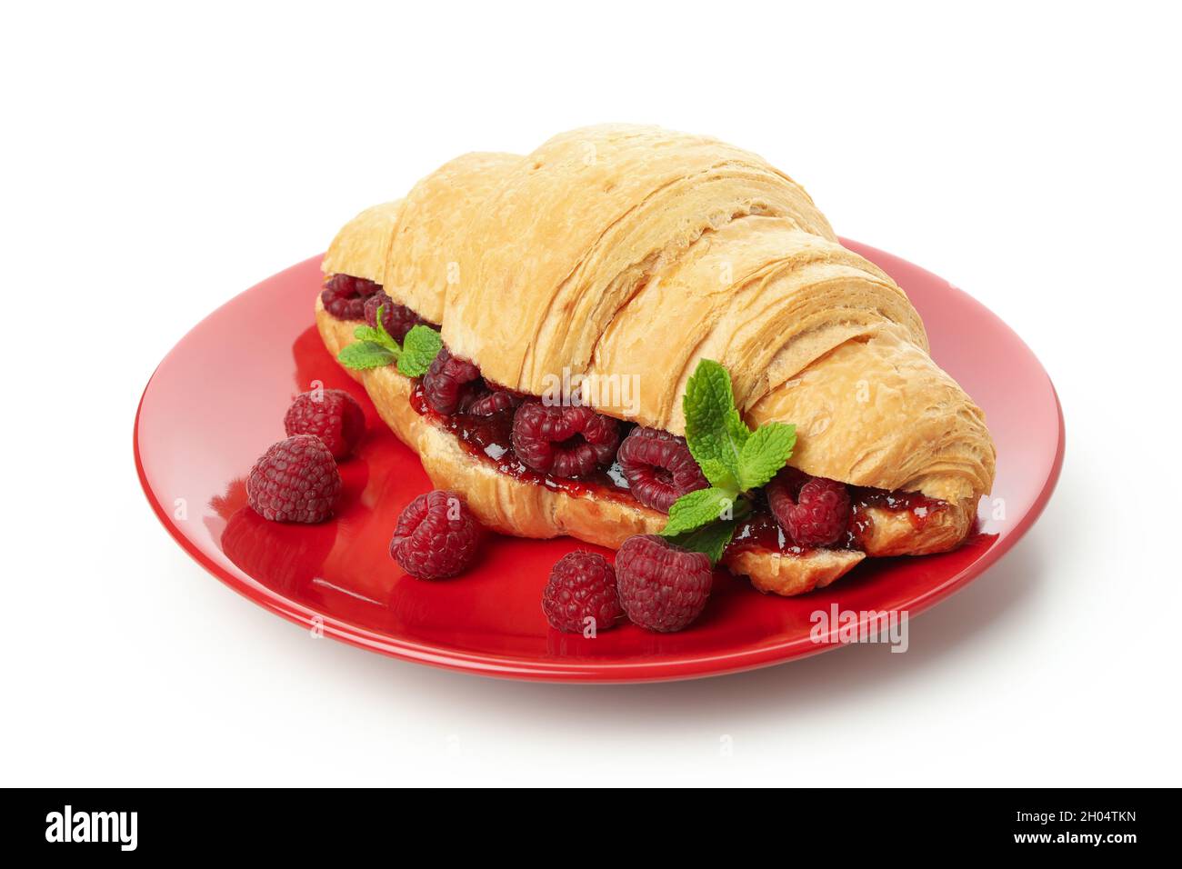 Plate with croissant with raspberry jam isolated on white background ...