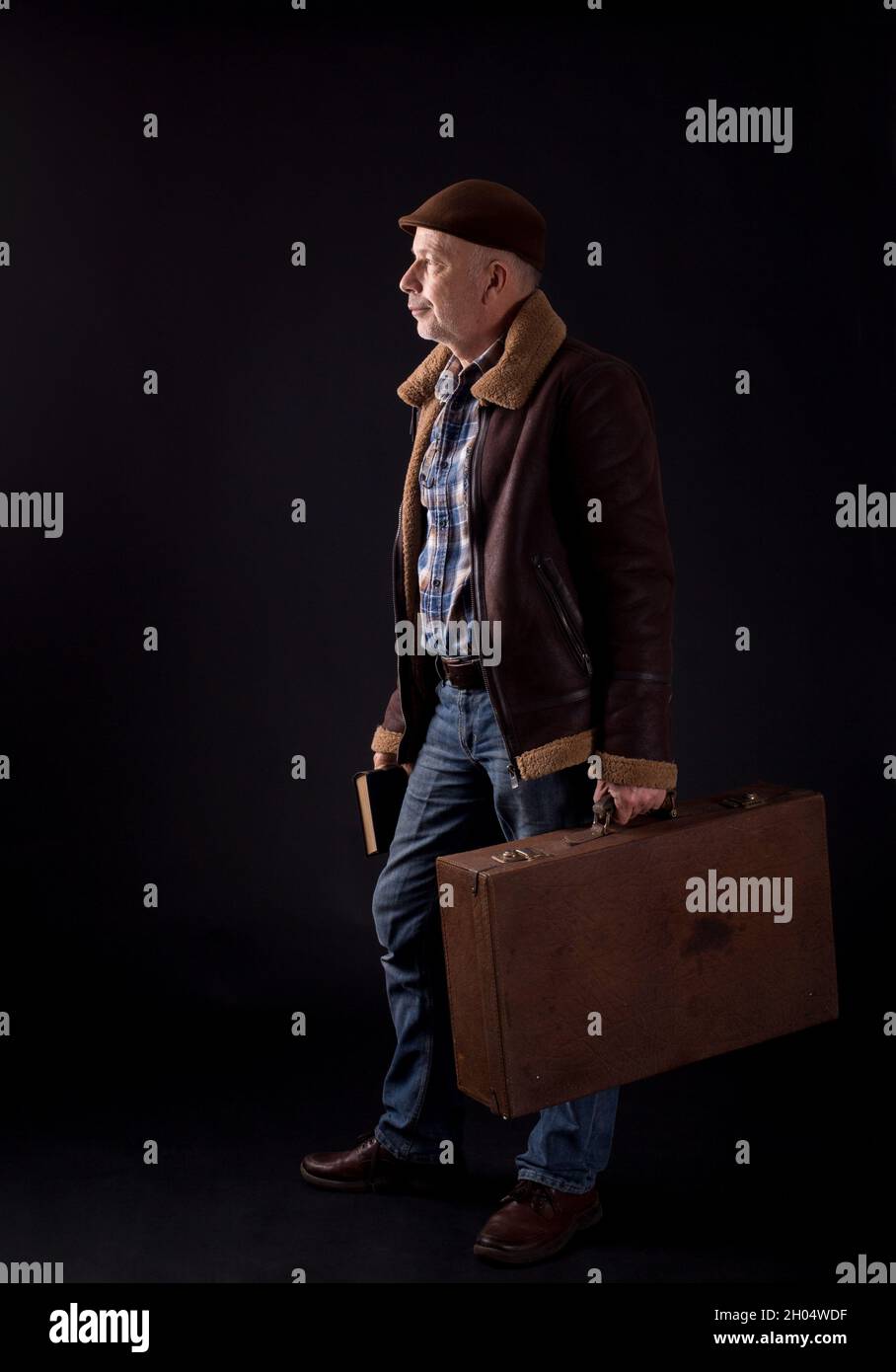 Senior man with old suitcase and standing and waiting something, on ...