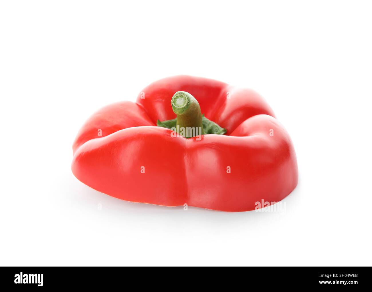 Slice of ripe paprika pepper on white background Stock Photo - Alamy