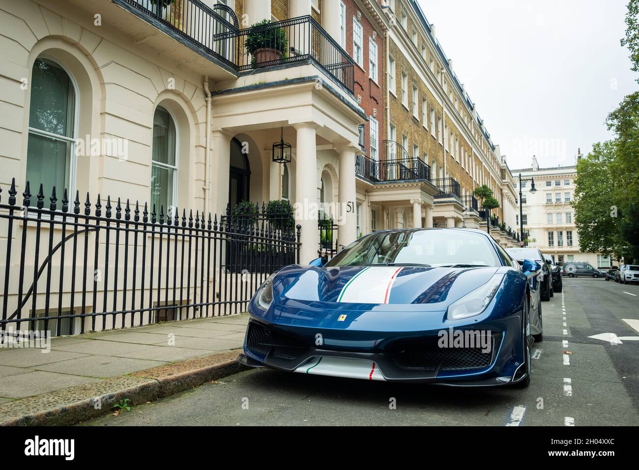 London- October 2021: A blue Ferrari parked on upmarket London street ...