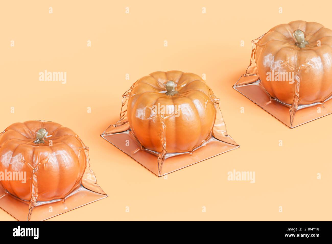 Pumpkins in vacuum packaging on beige background for advertising on ...