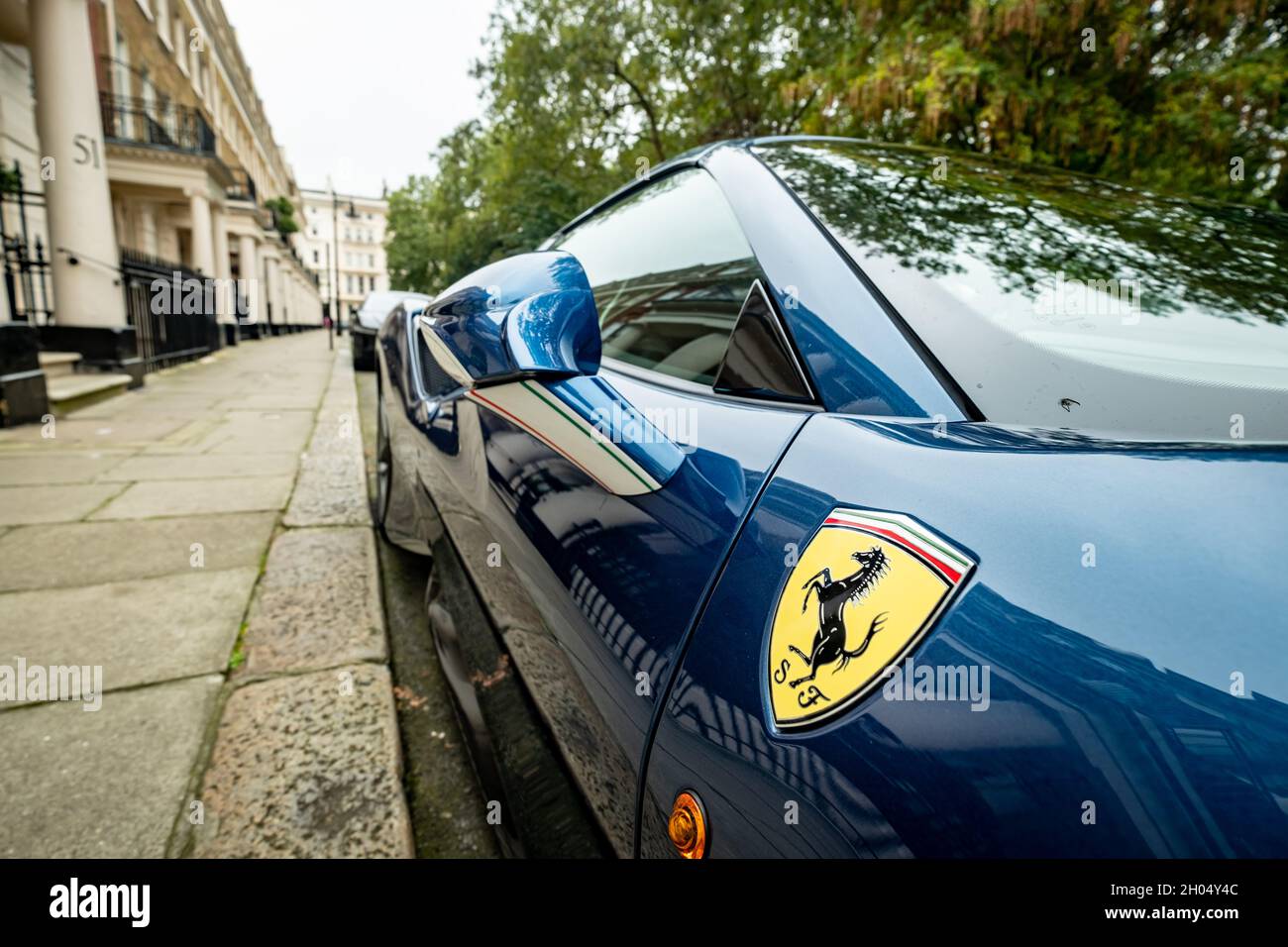 London- October 2021: A blue Ferrari parked on upmarket London street ...