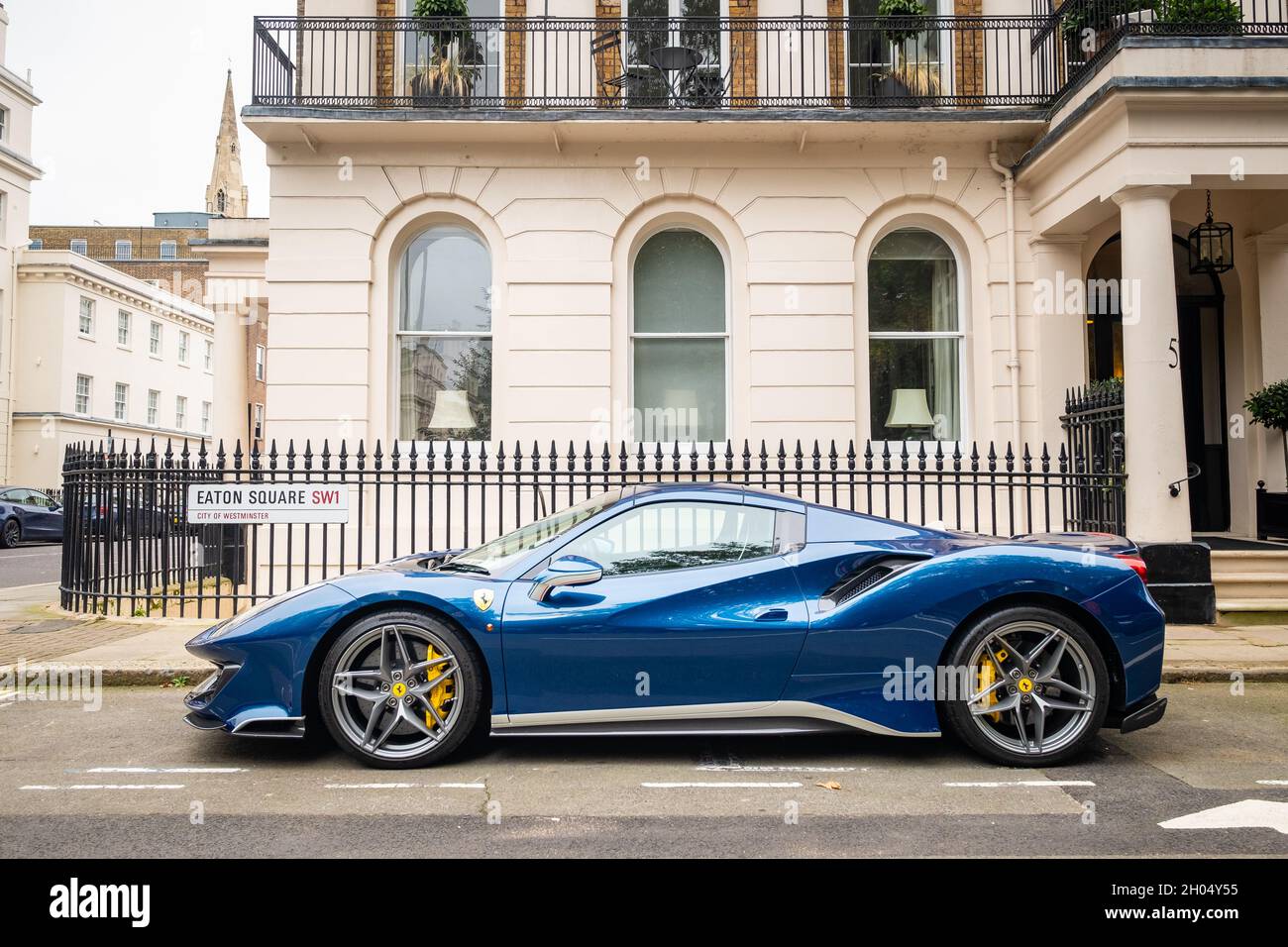 London- October 2021: A blue Ferrari parked on upmarket London street ...