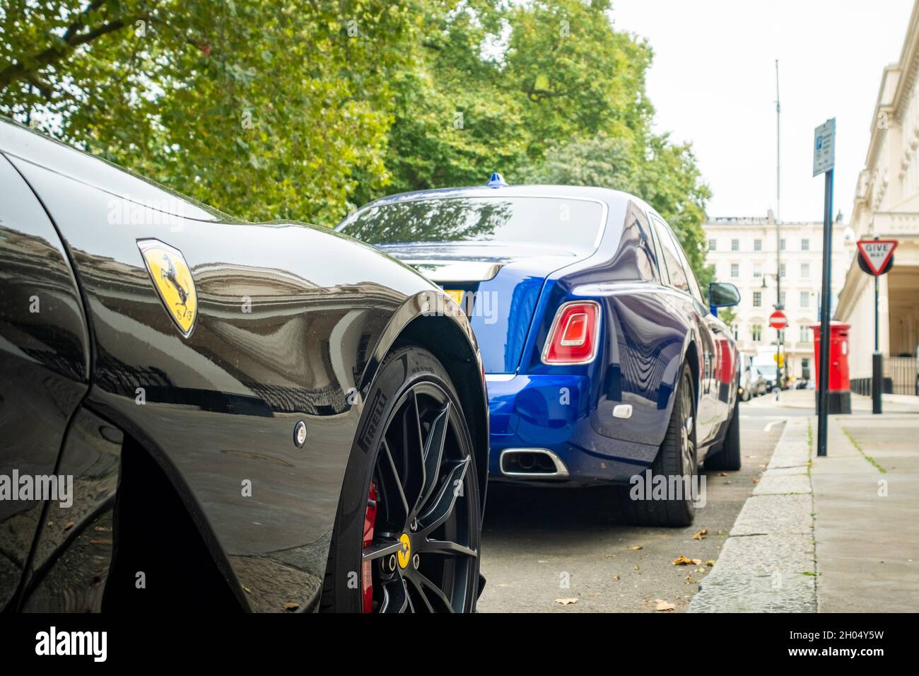 London- October 2021: A blue Ferrari parked on upmarket London street ...
