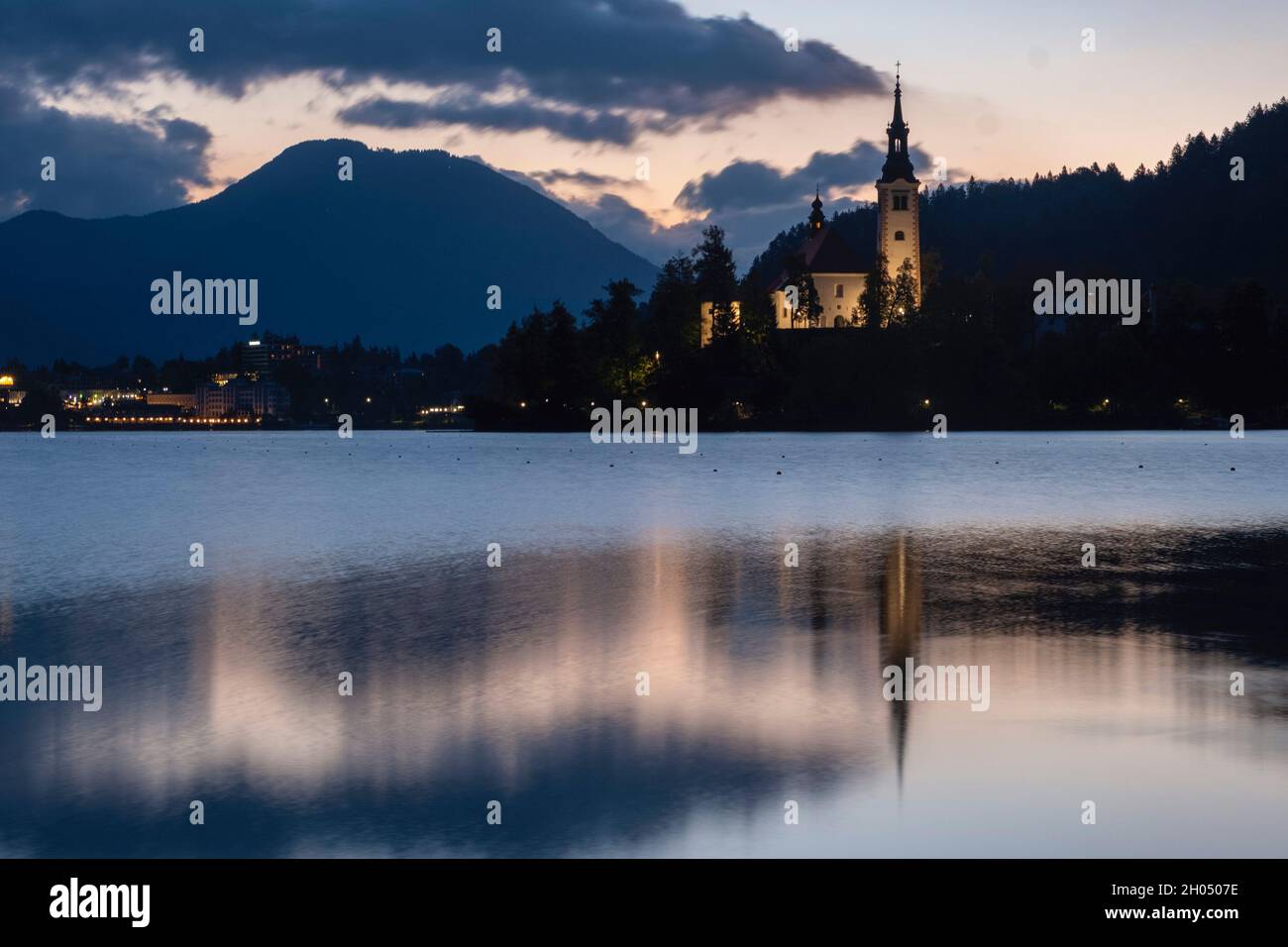 View of lake Bled and Bled Island from the shore at dawn Stock Photo ...