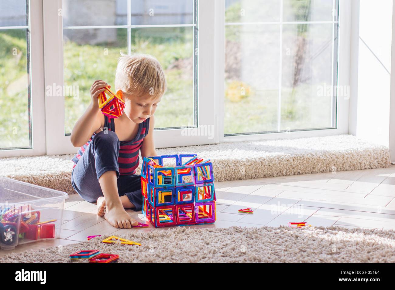 Block tower building children hi-res stock photography and images - Alamy