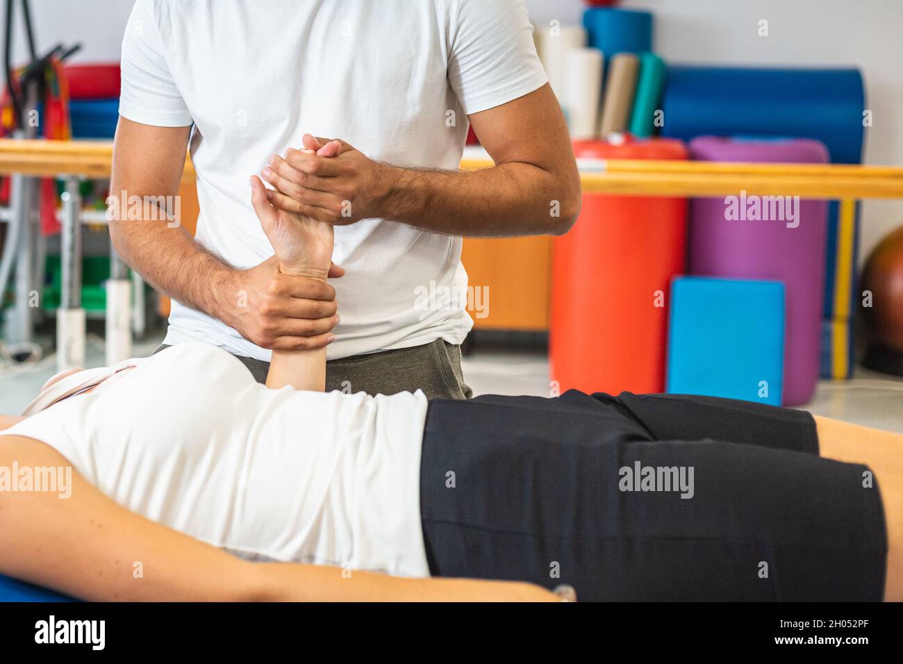 Physioteraphy exercises to help the female patient with hand and wrist ...