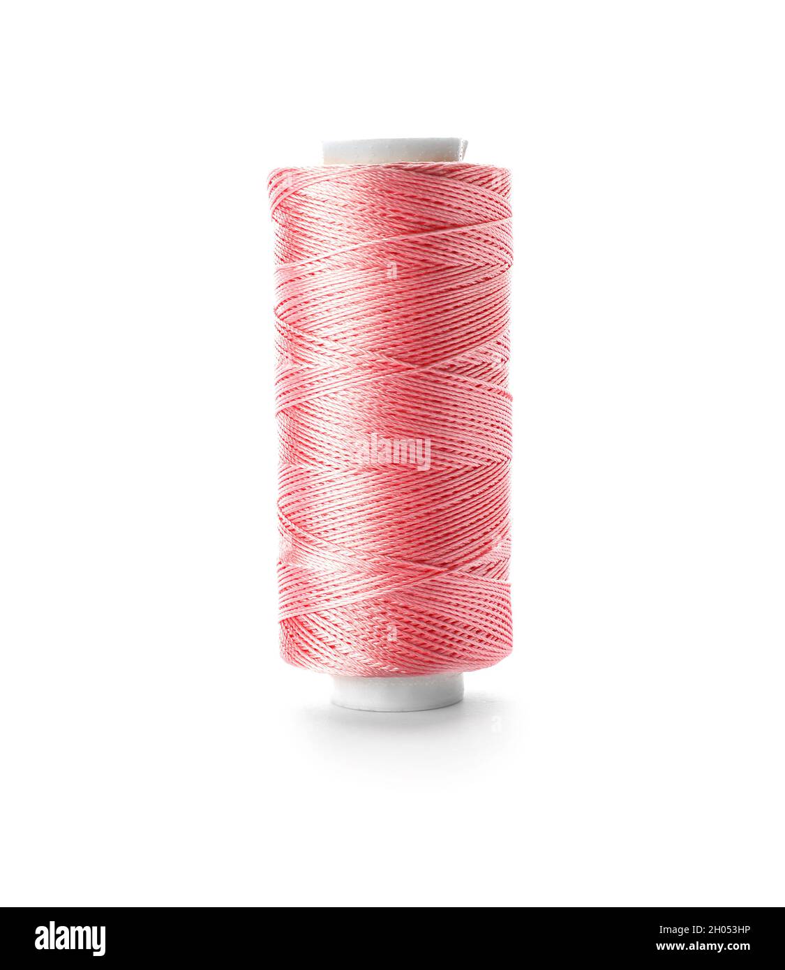 Color sewing thread on white background Stock Photo - Alamy