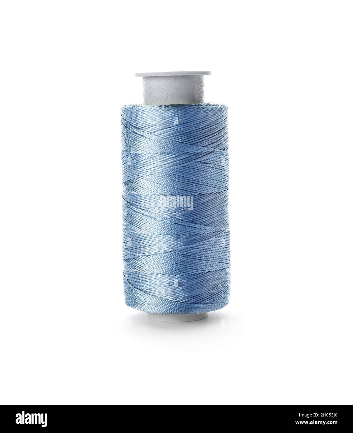 Color sewing thread on white background Stock Photo - Alamy