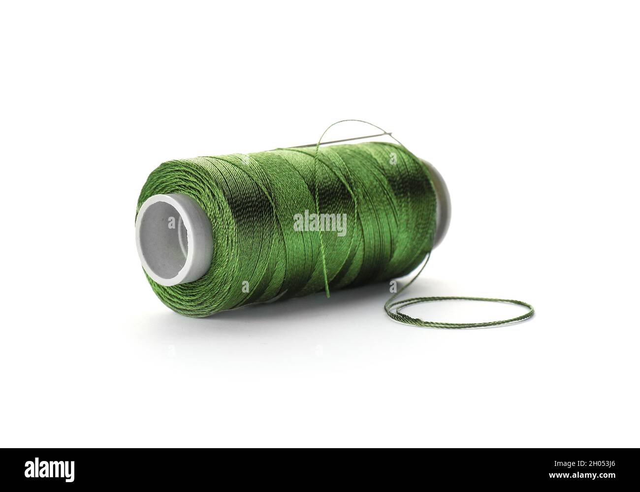 Color sewing thread on white background Stock Photo - Alamy
