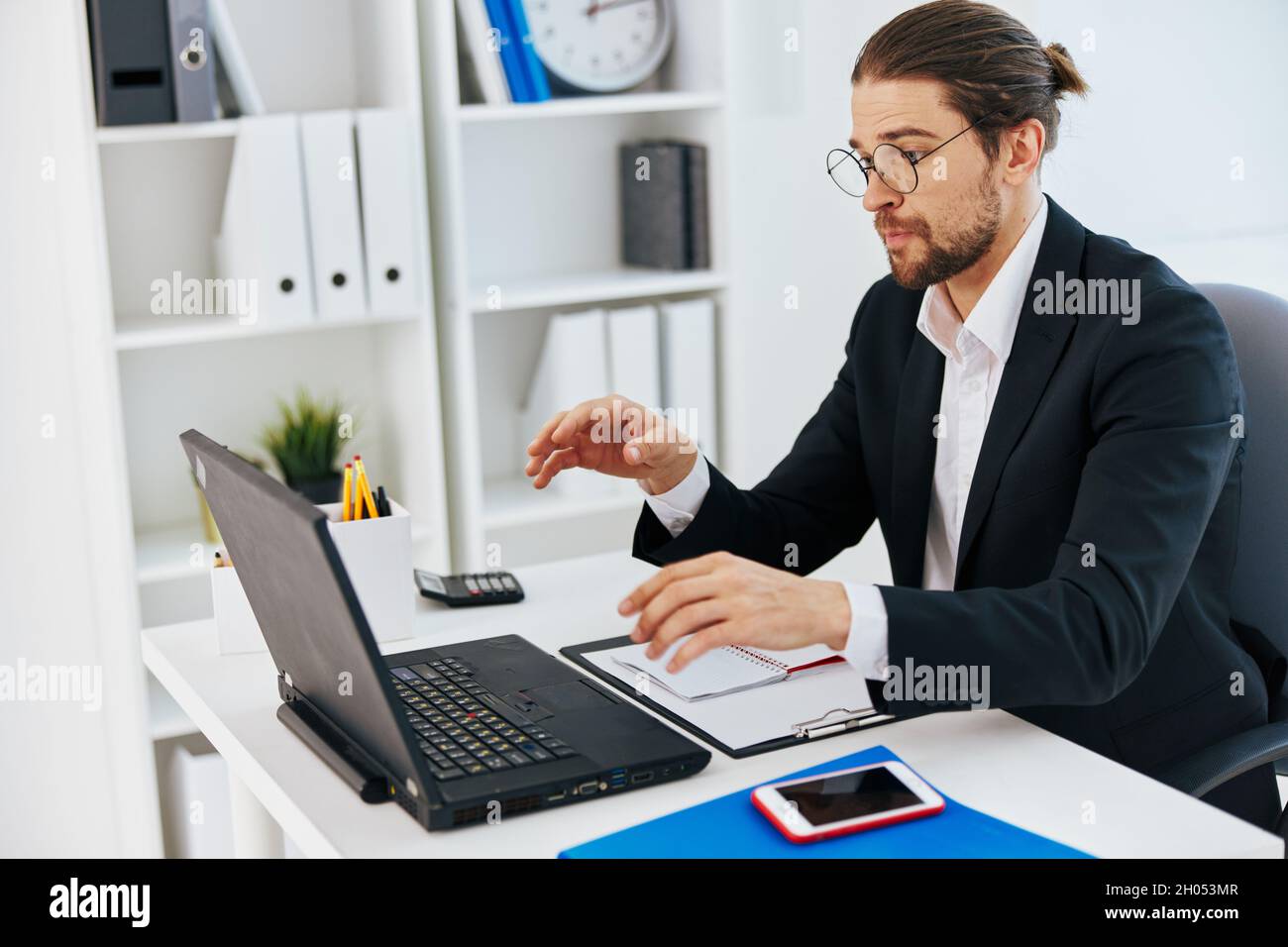 businessman documents work office laptop lifestyle Stock Photo - Alamy