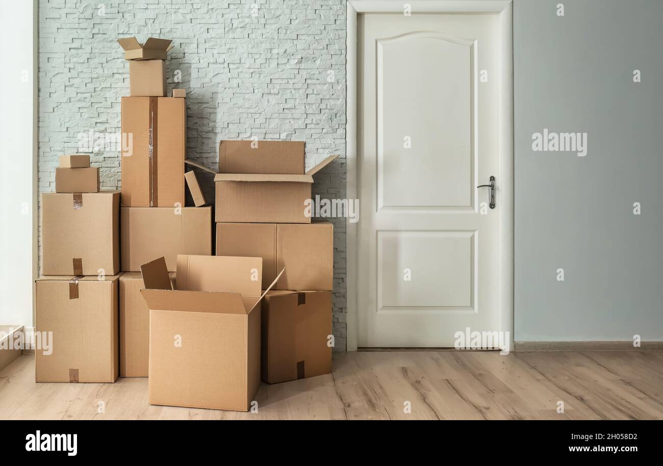 Cardboard boxes on floor indoors Stock Photo - Alamy
