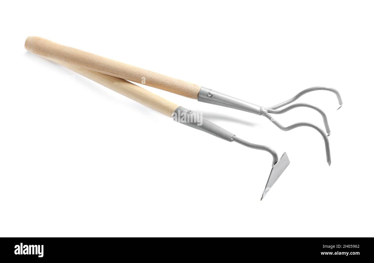 New rake and hoe on white background. Professional gardening tools ...