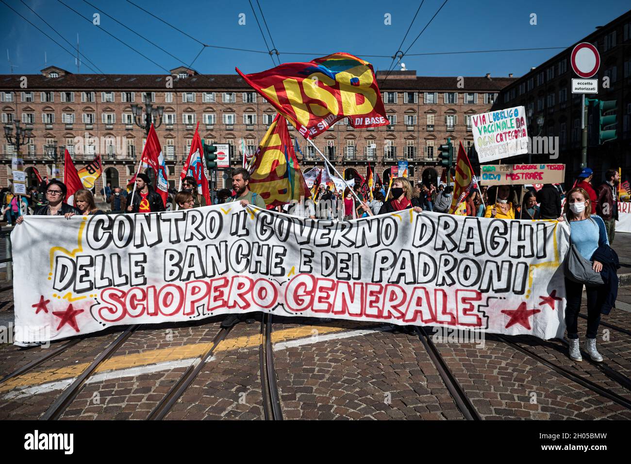 Turin, Italy. 11 October 2021. Protesters hold a banner during a ...