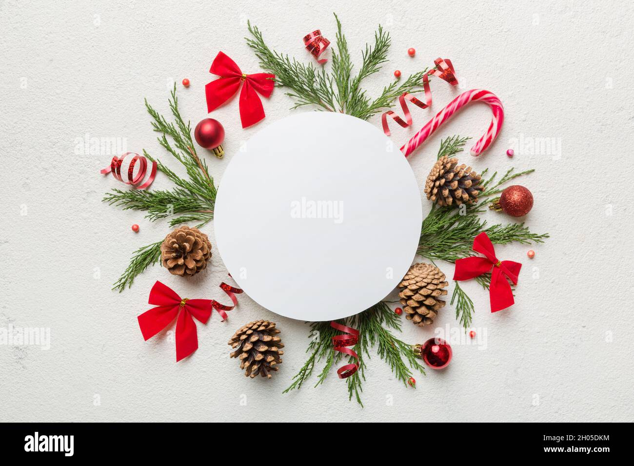 Flat lay Christmas composition. Round Paper blank, pine tree branches ...