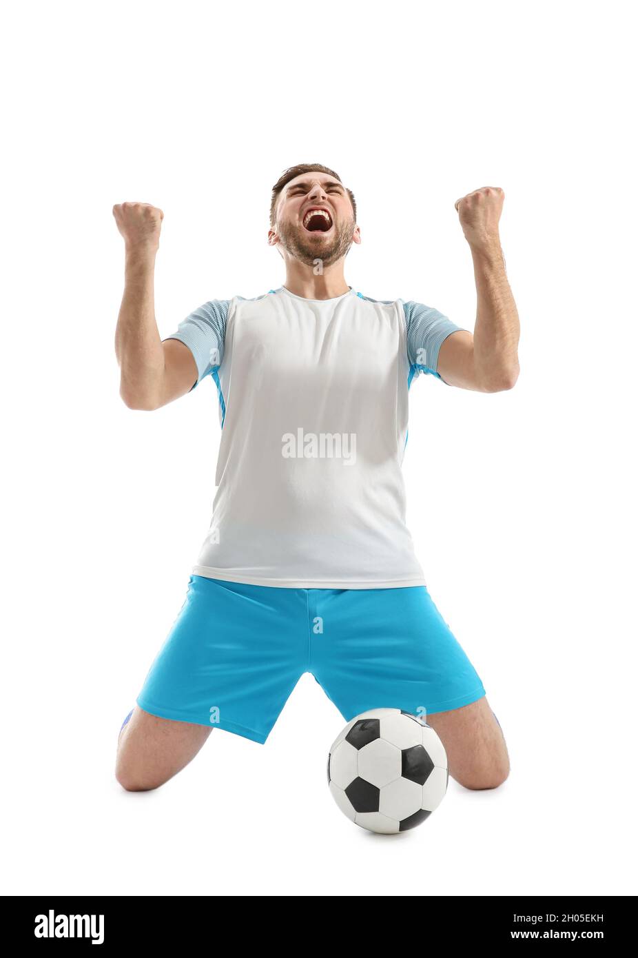 Young emotional football player on white background Stock Photo - Alamy
