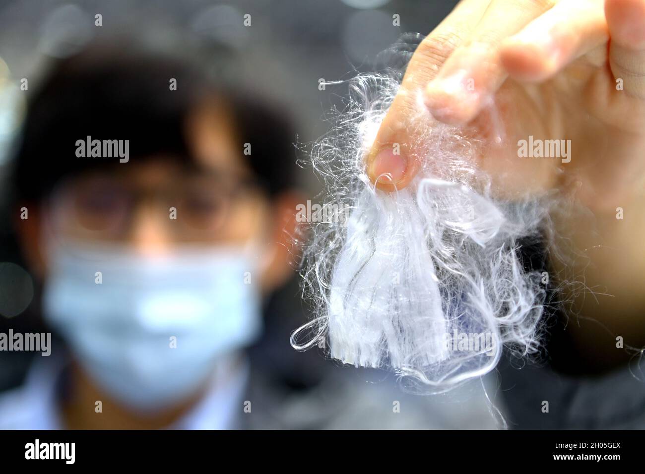 QINGDAO, CHINA - OCTOBER 11, 2021 - An exhibitor presents medical ...