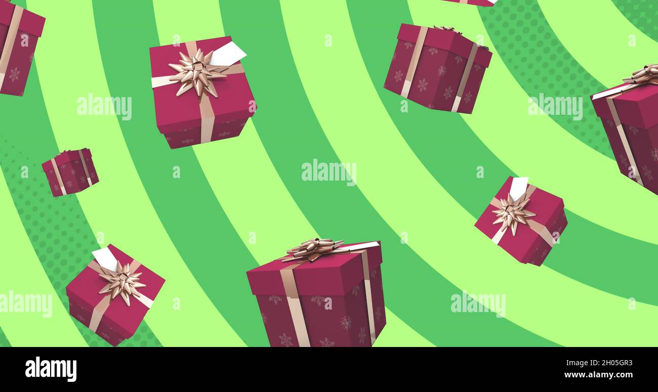 Image of presents falling at christmas on green background Stock Photo ...