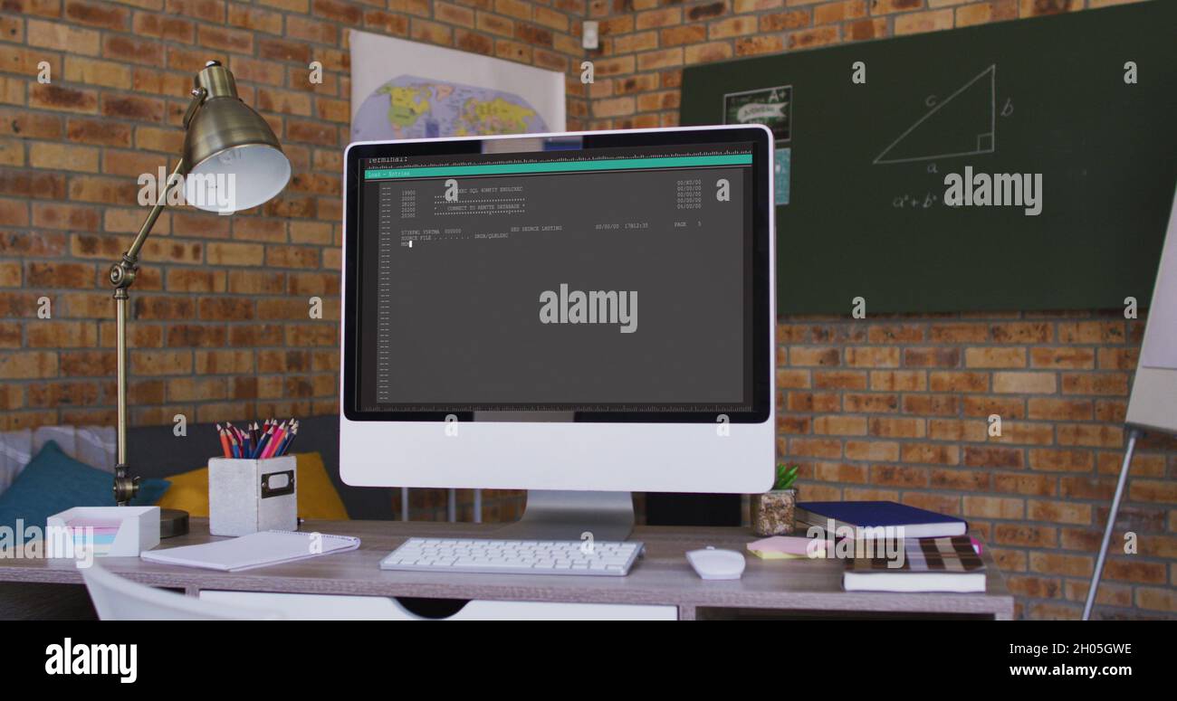 Computer screen with data processing standing on desk in office Stock ...