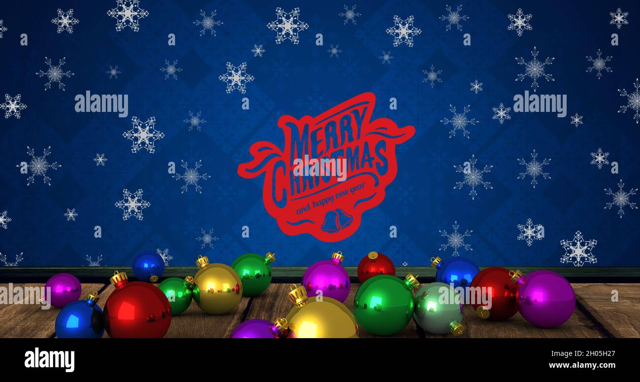 Image of baubles and snowflakes over merry christmas text on blue ...