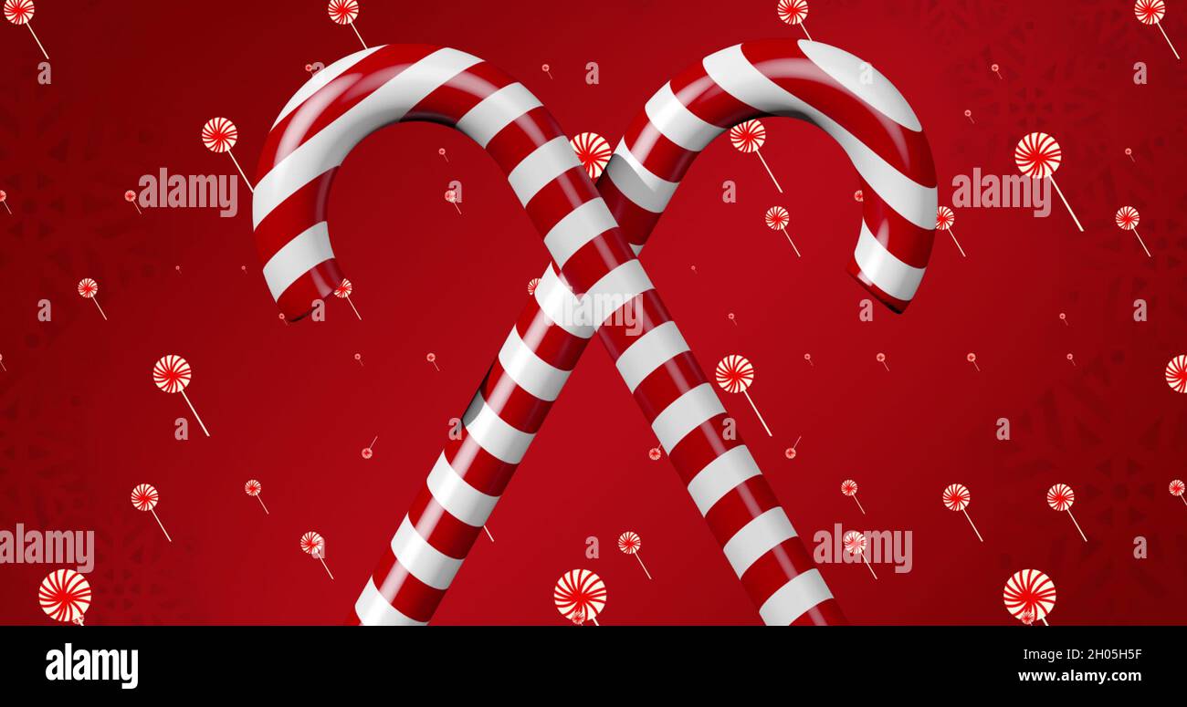 Image of falling lollipops over candy canes Stock Photo - Alamy