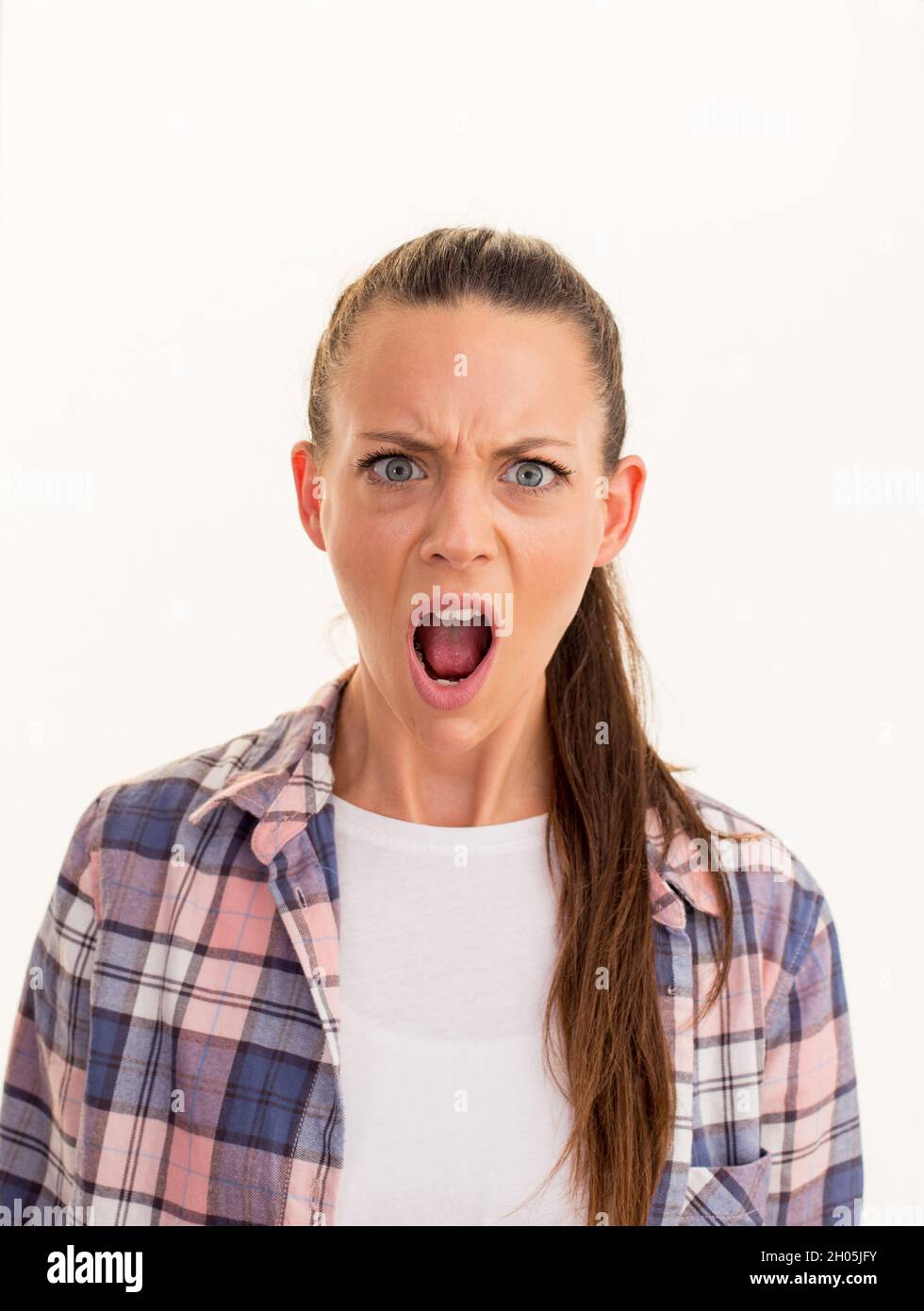 Portrait of angry young woman, shouting and have unpleasant facial ...